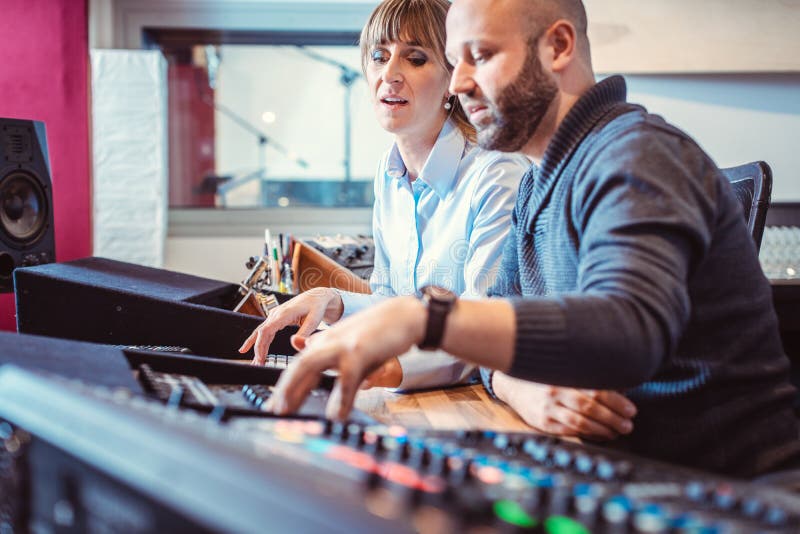 Sound Engineer and Singer or Musician Discussing the Mix Stock Image ...