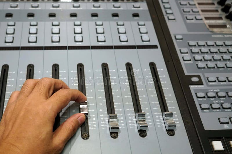 Sound Engineer Working on Mixing Console, Closeup of Hands Doing Adjust ...