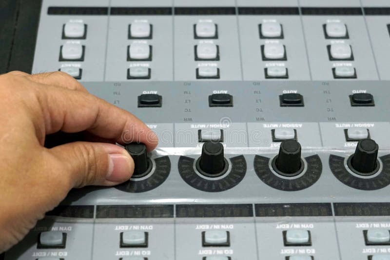 Sound Engineer Working on Mixing Console, Closeup of Hands Doing Adjust ...