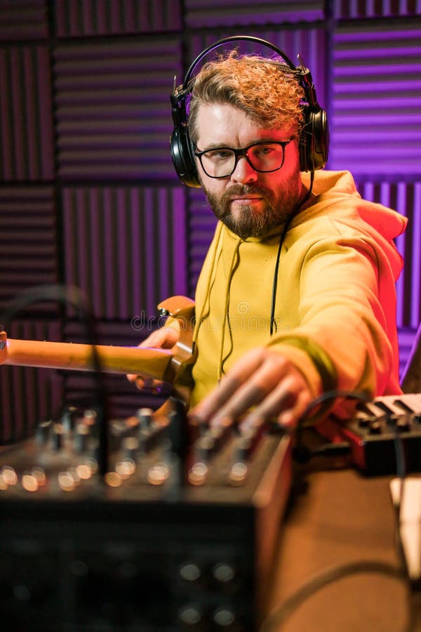 Sound Engineer Working at Mixing Panel in the Boutique Recording Studio ...