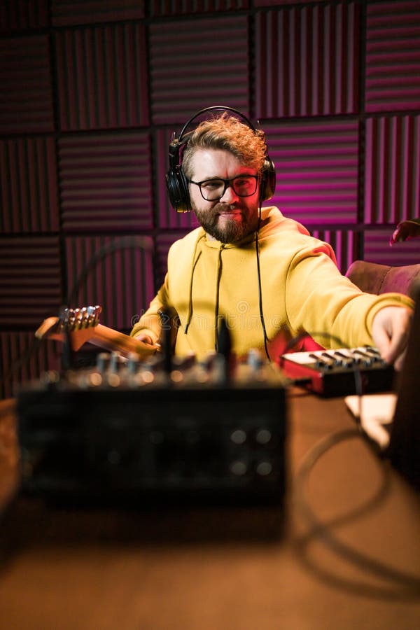 Sound Engineer Working at Mixing Panel in the Boutique Recording Studio ...