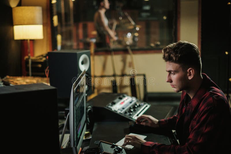 Sound Engineer Working in a Music Studio Stock Photo - Image of drums ...