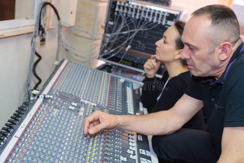 Sound Engineers Working at Mixing Panel in Recording Studio Stock Image ...