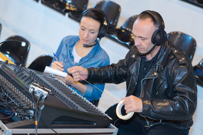 Sound Man and Woman Setting Up Equipment Stock Photo - Image of male ...
