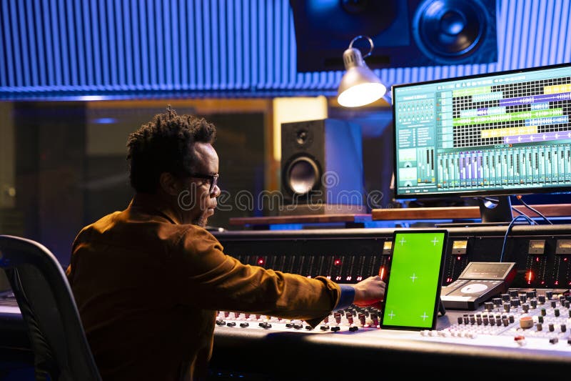 Sound Technician Mixing Tracks Next To Greenscreen Tablet in Control ...