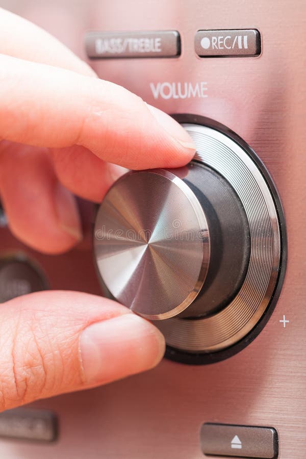 Fingers Adjusting a Volume Knob Stock Photo - Image of health, setting ...