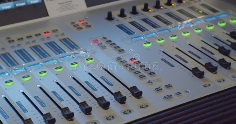 Close Up of Soundboard with Knobs and Green Color Equalizer in Night ...