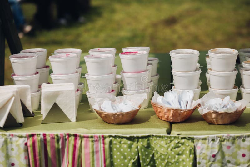 Soup in Containers on Table.Stacks of White Plastic Containers of Red ...