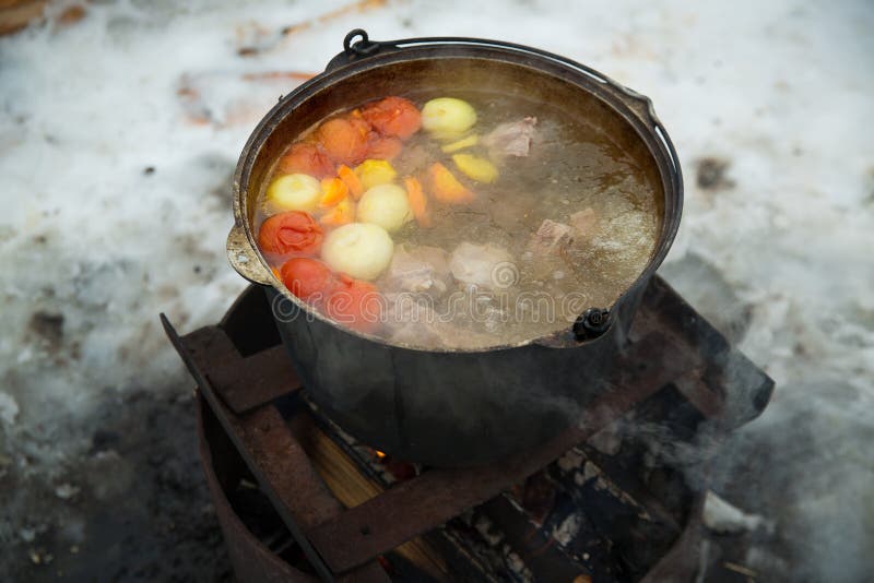 The Soup is Cooked in a Large Pot Over a Fire. Stock Photo - Image of ...