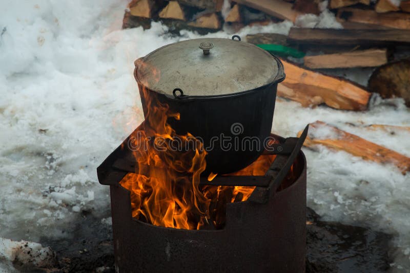 The Soup is Cooked in a Large Pot Over a Fire. Stock Photo - Image of ...