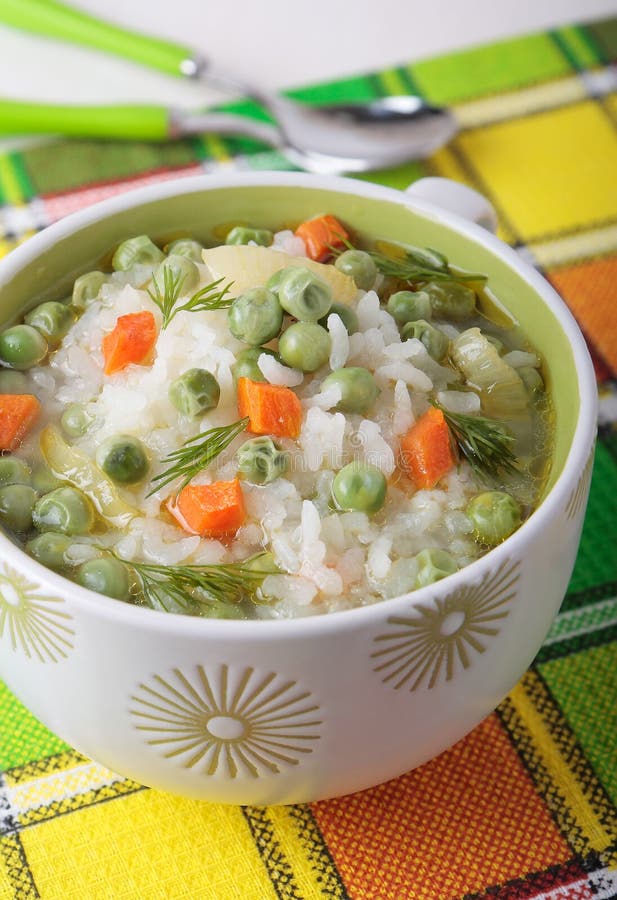 Soup with Green Peas, Rice and Carrots Stock Photo - Image of white ...