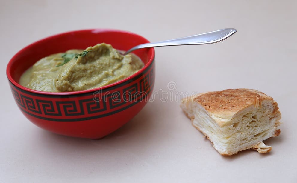 Soup Strained with Broccoli on a Table, a Spoon and a Piece of Fresh ...