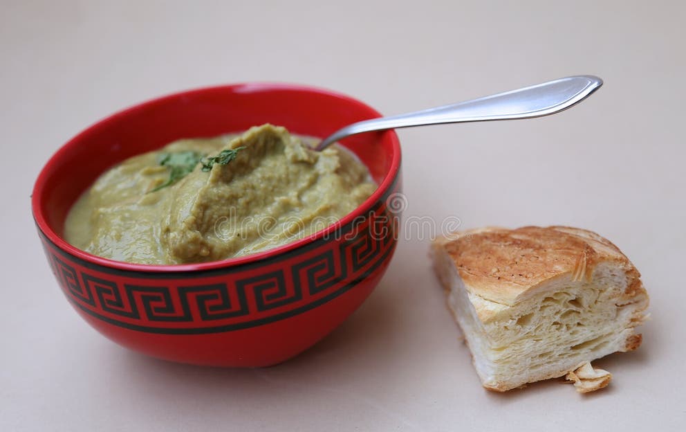Soup Strained with Broccoli on a Table, a Spoon and a Piece of Fresh ...