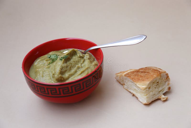 Soup Strained with Broccoli on a Table, a Spoon and a Piece of Fresh ...
