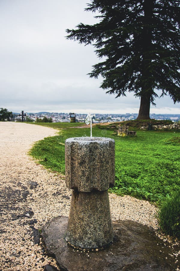 A Source of Drinking Water from a Natural Stone Tap, Against the ...