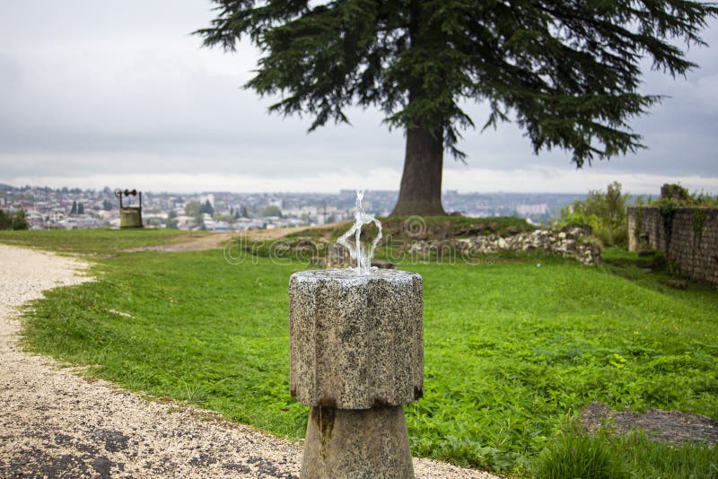 A Source of Drinking Water from a Natural Stone Tap, Against the ...