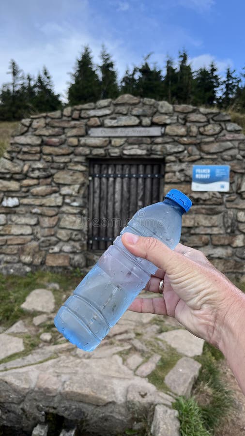 Source of the Morava River, Czech Republic. Hand Holding a Plastic ...