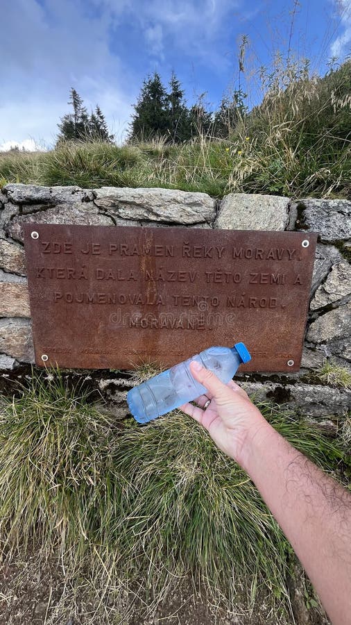 Source of the Morava River, Czech Republic. Hand Holding a Plastic ...