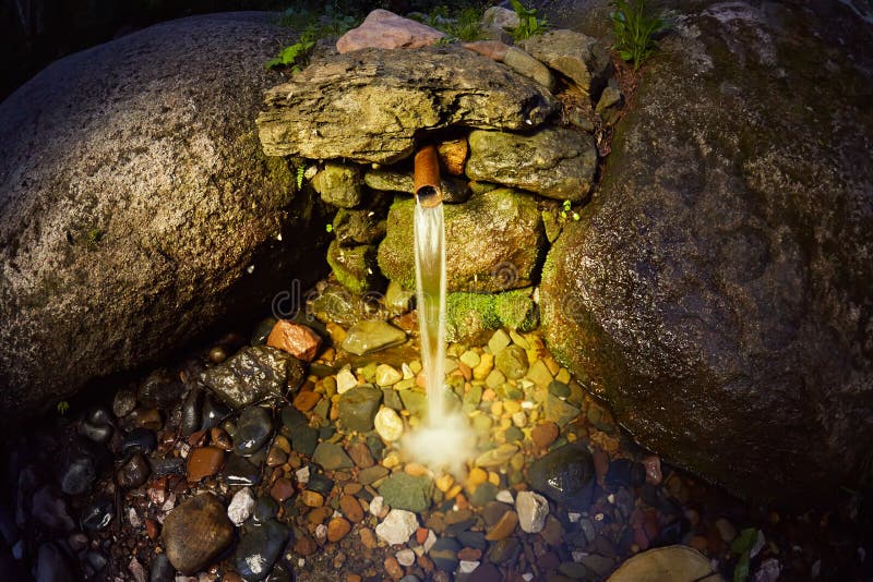 The Source of Natural Water, Wellspring, Flowing through Rocks in ...