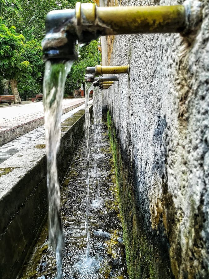 Natural Source of Spring Water in Forest Flowing from a Stone Fountain ...