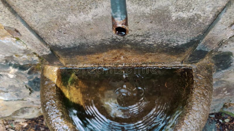 Source of Spring Water from a Metal Tap. Close-up. Top View. Drinking ...