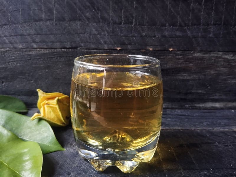 Soursop Leaf Boiled Water in Glass on Black Wooden Table Stock Photo ...