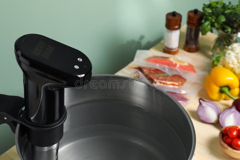 Sous Vide Cooker in Pot and Ingredients on Table, Closeup. Thermal ...