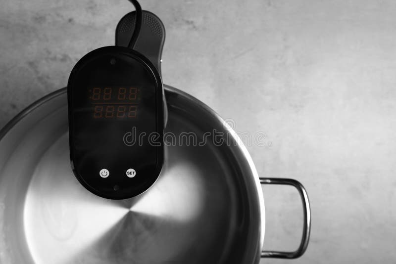 Sous Vide Cooker in Pot on Light Grey Table, Closeup. Thermal Immersion ...