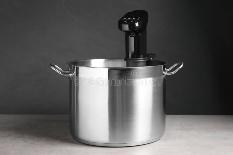 Sous Vide Cooker in Pot on Light Grey Table. Thermal Immersion ...
