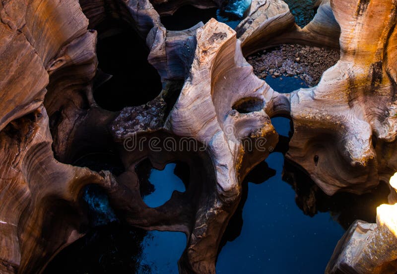 South African Potholes Against the Tranquil Waters Below Stock Photo ...