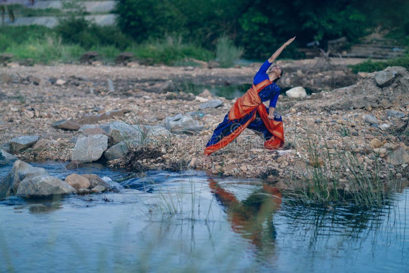 South Asian Yogini in Sari Doing Asana on a Beach. Stock Image - Image ...