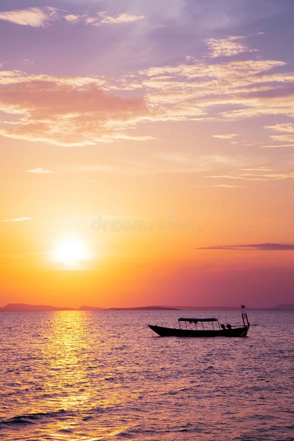 Asian sunset over water stock image. Image of dusk, yellow - 3542823