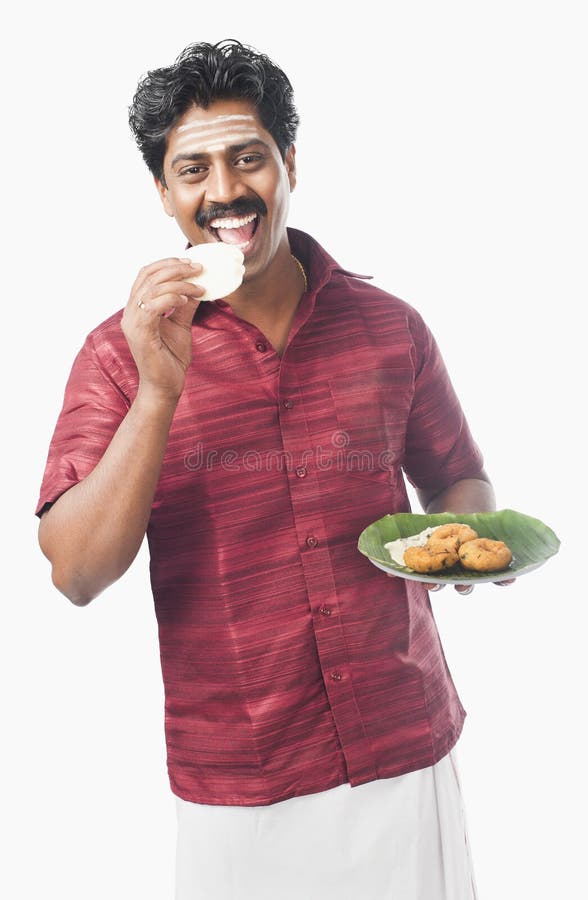 South Indian Man Having Idli Stock Photo - Image of adult, camera: 36256120