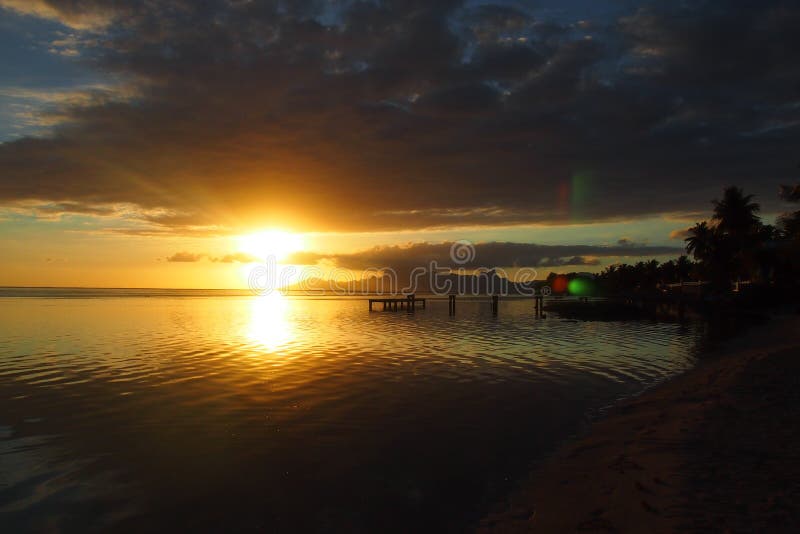 South sea sunset Tahiti stock photo. Image of ocean - 164576148