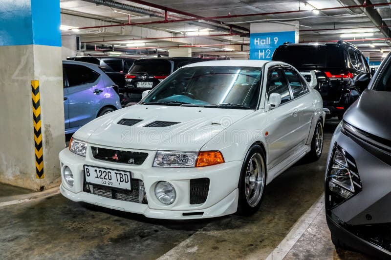 White Mitsubishi Lancer Evolution V in Indonesia Modification Expo 2024 ...