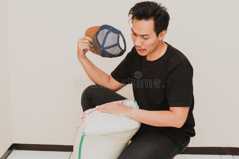 A Southeast Asian Man Tired after Lifting Sack of Rice Stock Image ...