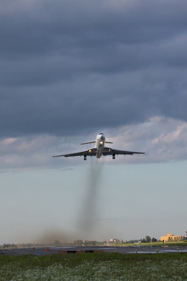 Soviet Airplane Taking Off from Military Airfield, Smoke from Engines ...
