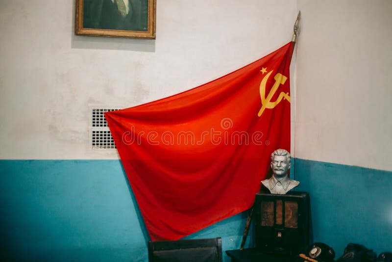 Soviet Red Flag with a Sickle and a Hammer and a Bust of Lenin in the ...