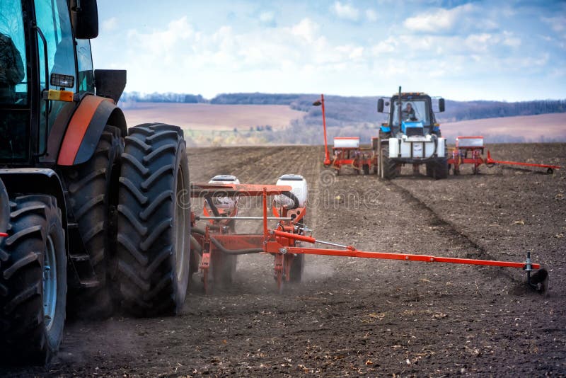 Sowing Work in the Field. Tractor with Seeder Stock Image - Image of ...