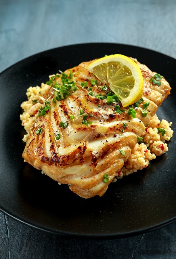 Soy-glazed Cod Loin Fillet with Cous-cous Salad on Black Plate Stock ...