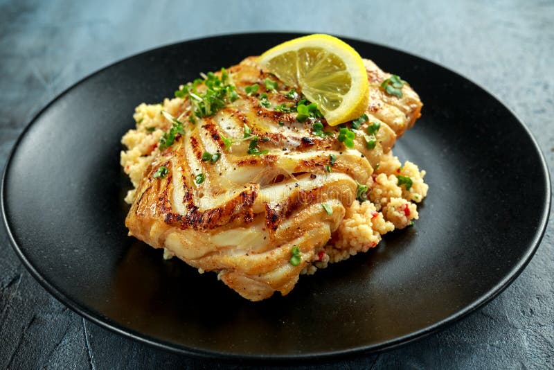 Soy-glazed Cod Loin Fillet with Cous-cous Salad on Black Plate Stock ...