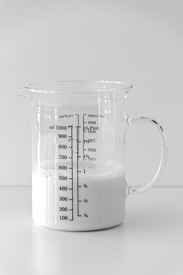 Measuring Cup With Milk stock image. Image of milk, measure - 14178877