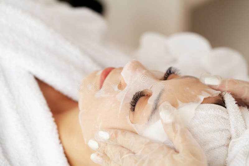 Spa, Attractive Funny Woman with a Clay Mask on Her Face. Stock Photo ...