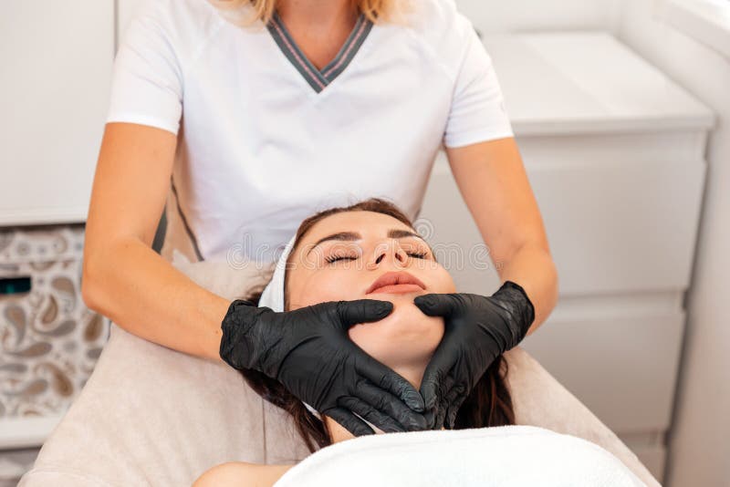 Spa And Beauty Procedure Professional Cosmetologist Gives A Facial