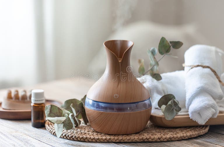 Spa Composition with Aroma Oil Diffuser Lamp on a Blurred Background. Stock Photo - Image of ...
