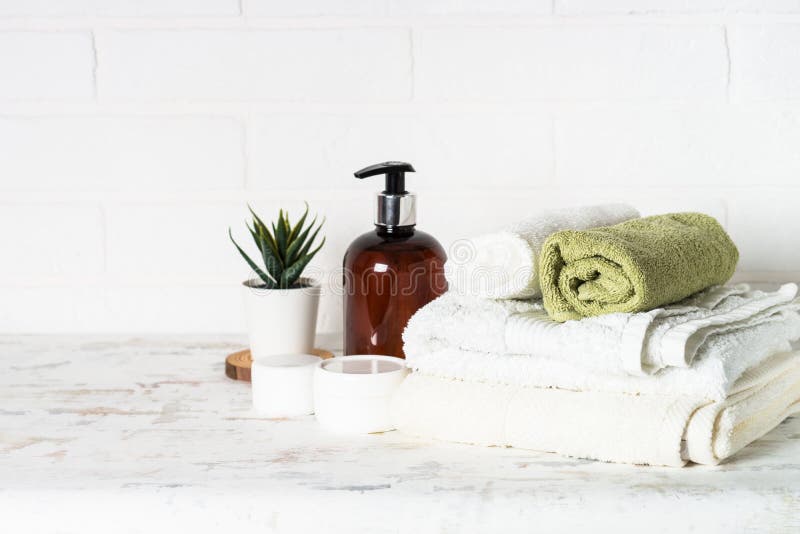 Bottle of Soap and Stack of Towels in White Bathroom. Stock Photo ...