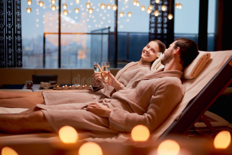 Beautiful Young Married Couple Enjoying And Relaxing In Spa Center