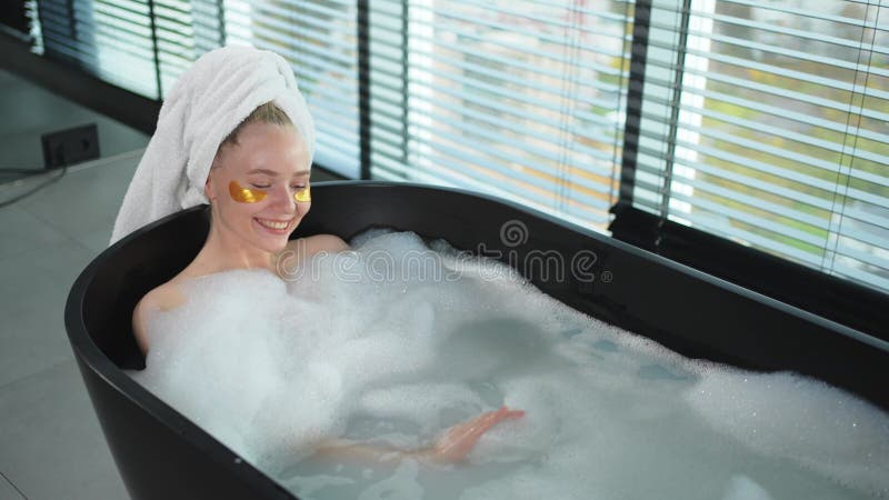 Spa Relaxation Young Woman Lying In Bath With Foam Bubbles Girl