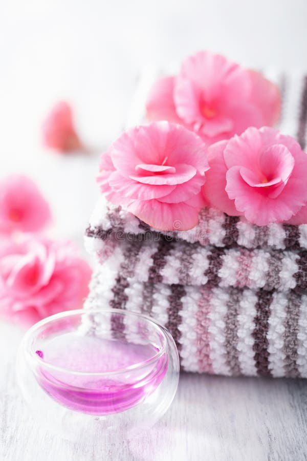 Spa Set with Begonia Flowers and Essential Oil Stock Photo - Image of ...