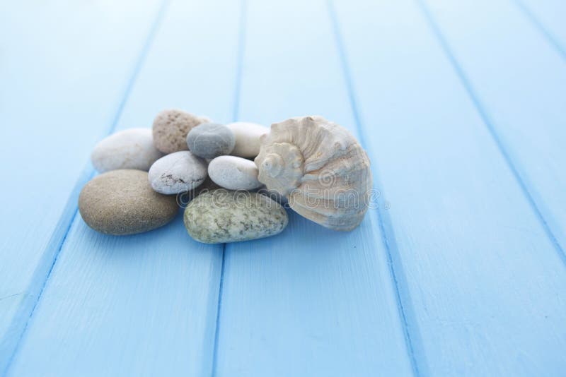 Spa Stones on Table Light Background and Large Sea Shell Stock Image ...